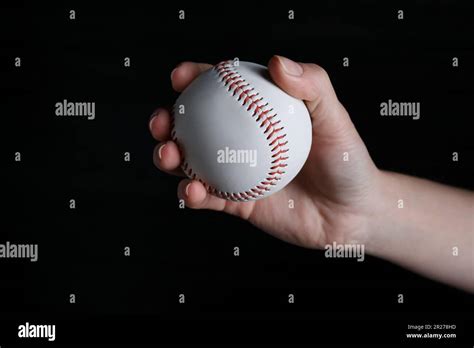 Baseball Player Holding Ball On Black Background Closeup Sports Game