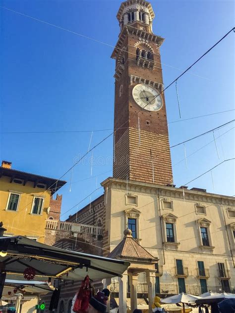 Big Tower Clock At Bell Tower Of Old Church In Downtown Verona Italy