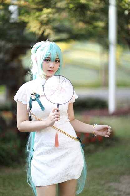 Premium Photo Full Length Of A Girl Holding Camera While Standing On