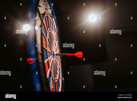 Dart Board With An Arrow In The Center Stock Photo Alamy
