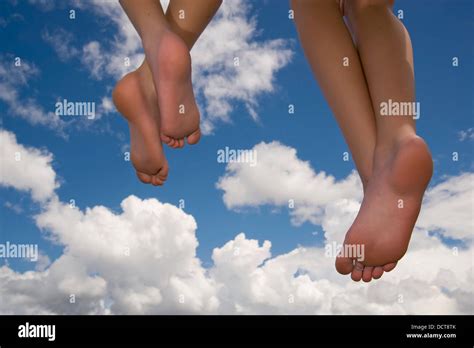 Angel Concept Feet Floating In Sky Against Clouds Stock Photo Alamy