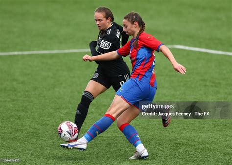 Lizzie Waldie Of Crystal Palace Clears The Ball While Under Pressure