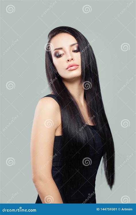 Stylish Young Woman Brunette With Long Healthy Perfect Straight Hair