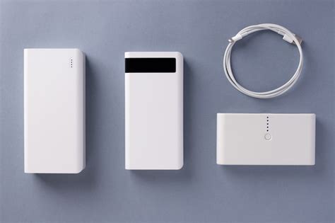 Premium Photo Three Various Power Bank Chargers And A Usb Cable