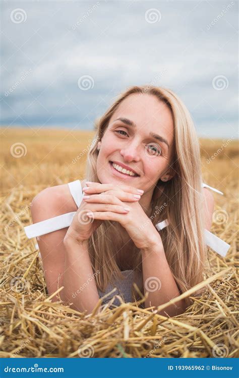 Portrait Of Bohemian Girl With White Art Posing Over Wheat Field Stock