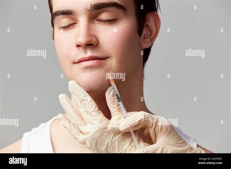 Face Rejuvenation Portrait Of Young Man Doing Cosmetological