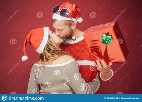 Happy Couple Kissing At Christmas Time Romantic Young Love Story