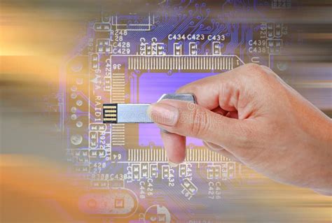 Hand Holding Usb Data Storage Against Bright Light And Circuit Stock