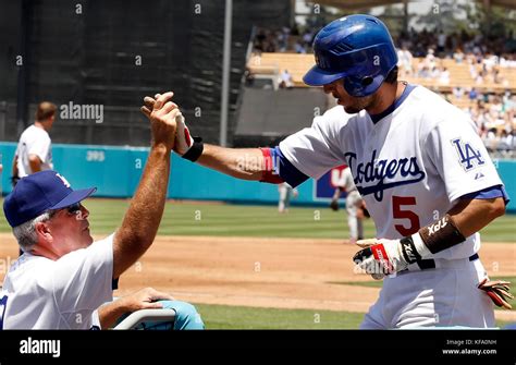 Los Angeles Dodgers Nomar Garciaparra Right Is Greeted In The Dugout