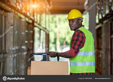 Warehouse Worker Loading Unloading Boxes Warehouse Logistics Concept Stock Photo By Visoot