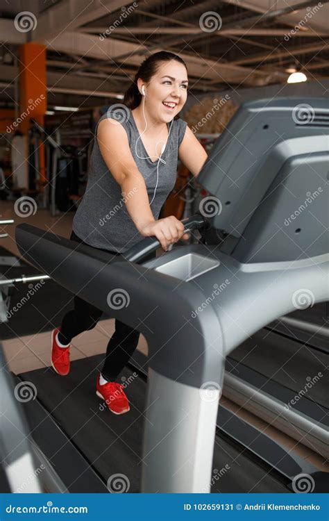 The Girl Is Smiling On The Treadmill Inside Stock Image Image Of