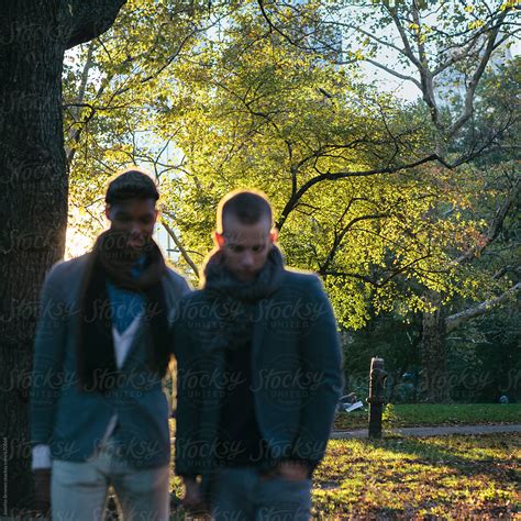Young Gay Couple Sharing And Enjoying Romantic Autumn In New York In