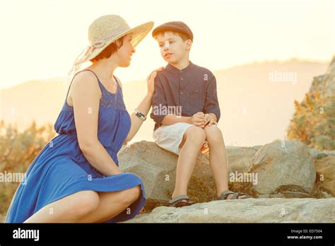 Loving Mother And Son Outdoors On Sunset Stock Photo Alamy