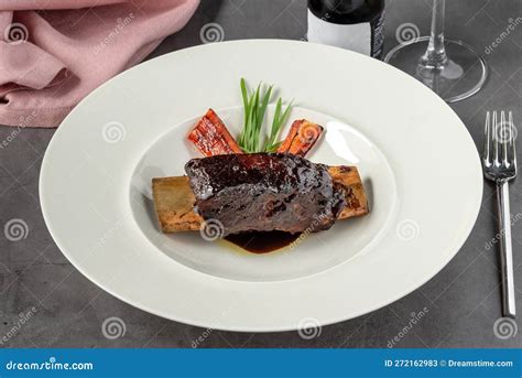 Long Cooked Marinated Beef Ribs On A White Porcelain Plate Stock Image