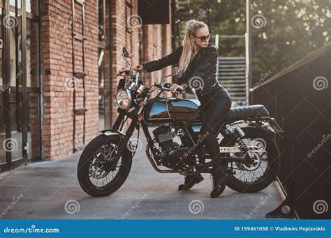 Portrait Of Beautiful Blond Biker In Leather Clothing Stock Photo Image Of Girl Pensive