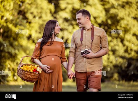 Happy Pregnant Couple Enjoying In Naturehusband With His Pregnant Wife
