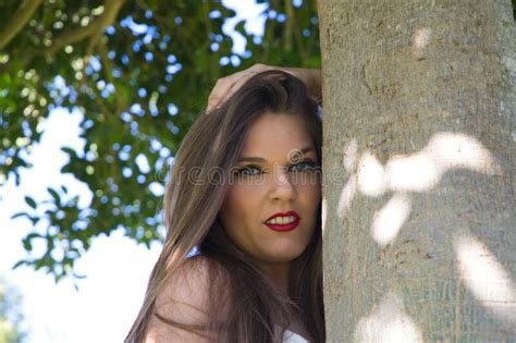 Portrait Of A Beautiful Young Woman With Blonde Hair And Blue Eyes