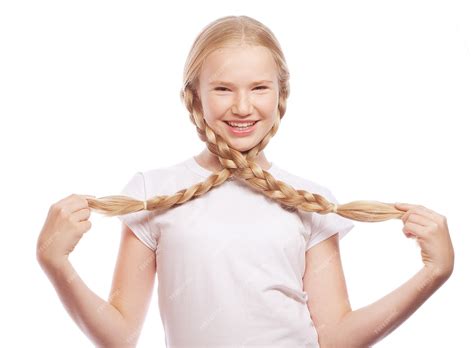 Premium Photo Portrait Of A Beautiful European Blonde Girl With Braids