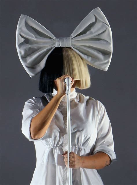 Why Does Sia Cover Her Face With A Wig Heres The Answer Allure