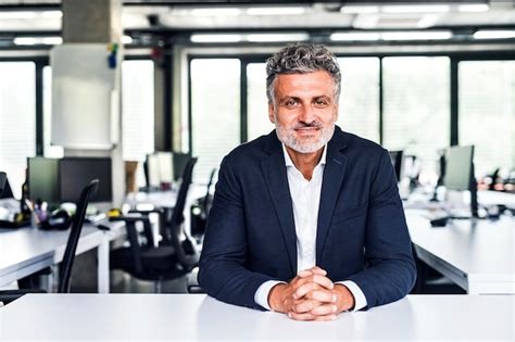 Premium Photo Portrait Of Smiling Mature Businessman In Office