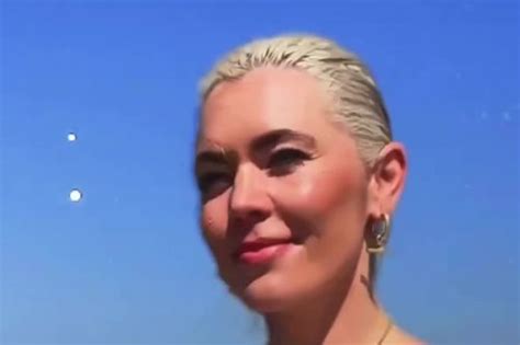 Danni Menzies Shows Off Toned Bronzed Legs In Skimpy Swimsuit On