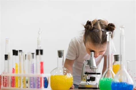 Free Photo Girl Checking Microscope In Lab