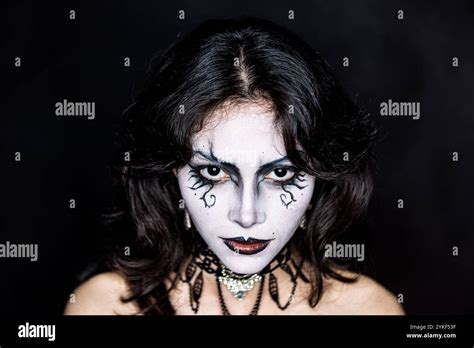 A Striking Portrait Of A Woman With Intense Dramatic Gothic Makeup Her Pale Skin Contrasts With