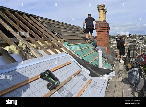 Roofing Work Removing Old Felt And Replacing With New Breather