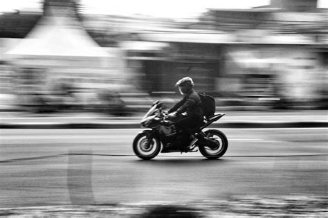 Premium Photo Blurred Motion Of Man Riding Motor Scooter On Street