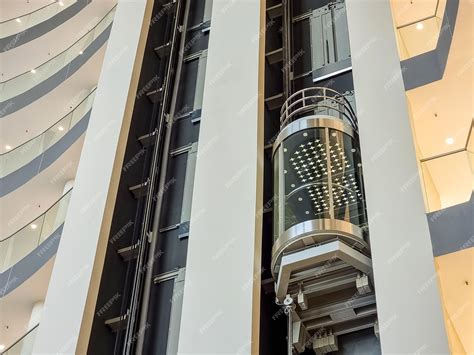 Premium Photo Glass Capsule Elevator Lift At Luxury Hotel Or Buildingmodern Glass Elevator To