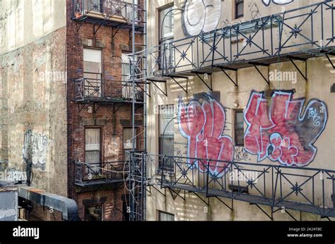 Rustic Residential Building Facade In Chelsea With Graffiti On The Wall