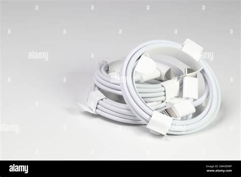 New White Usb Type Charger Cable Compatible For Many Devices Wrapped In A Spiral Shape