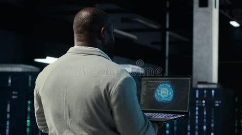 It Expert Walking In Server Hub Using Laptop To Enhance Ai Model Accuracy Stock Video Video Of
