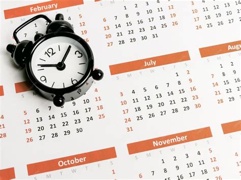 Premium Photo Time Management Concept Alarm Clock On Calender