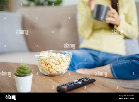 Asian Woman Watching Smart Tv And Using Remote Controller Hand Holding Television Audio Remote