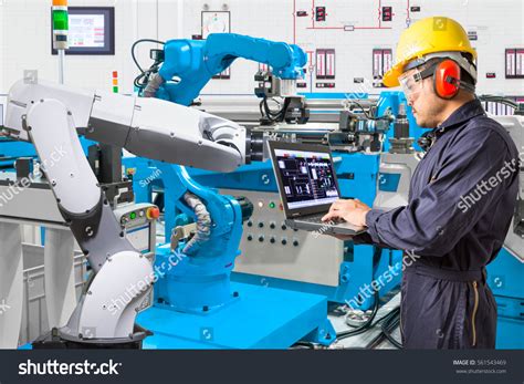 Engineer Using Laptop Computer Maintenance Automatic Stock Photo