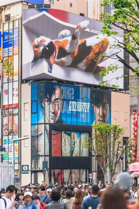 Crowd Walking Towards A Poster Of Netflix Film City Hunter And The