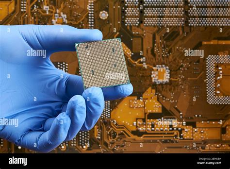 Engineer Person Holds Cpu Central Processor Unit Over Circuit Board