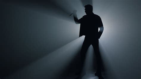 Silhouette Offender Raising Hand With Knife In Dark Dangerous Criminal