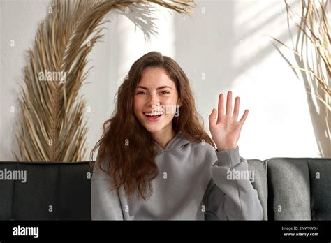 Happy Woman Blogger Smiling Waving Hand Talking To Webcam Recording