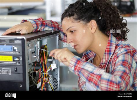 Woman Fixing A Desktop Computer Stock Photo Alamy