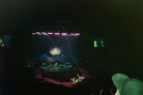 People Enjoying A Concert In The Dark