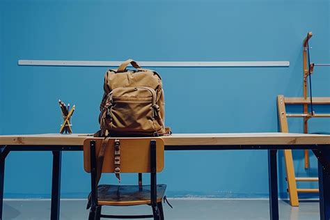 Organized School Desk Setup With Chair And Backpack Premium Ai Generated Image