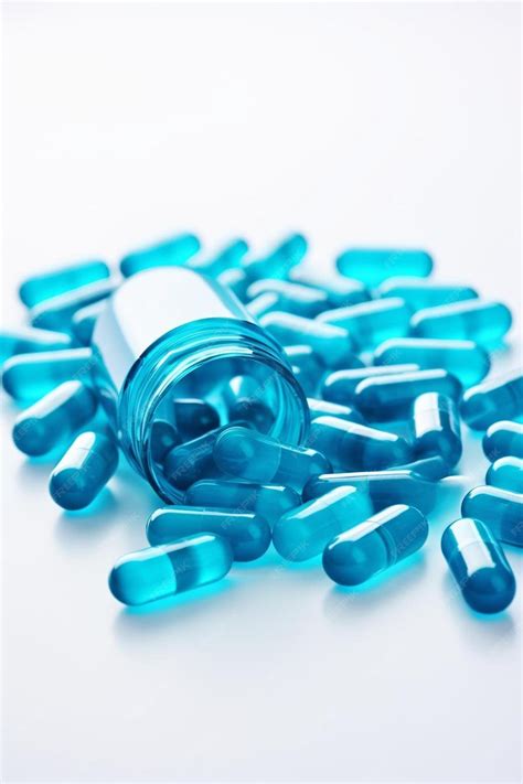 Premium Photo Blue Antibiotic Capsule Pills Spread On White