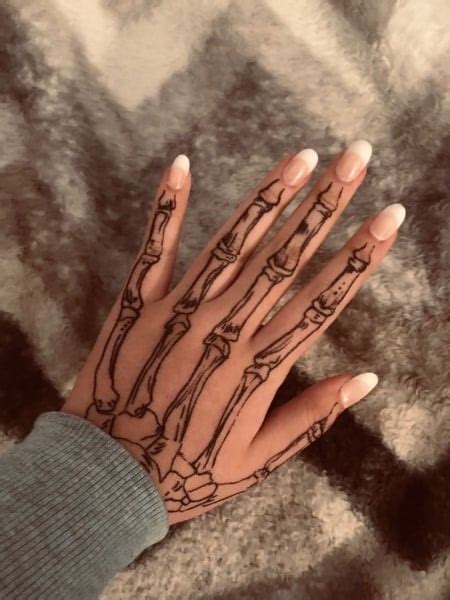 20 Cool Skeleton Hand Tattoo Ideas And Meaning The Trend Spotter