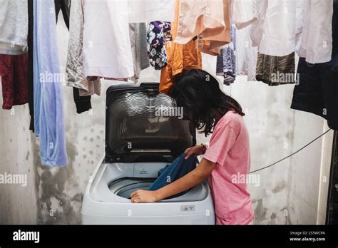 Asian Teen Girl Doing Laundry Stock Photo Alamy