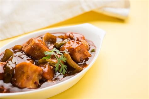 Premium Photo Chilli Paneer Or Spicy Cottage Cheese Served In White