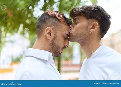 Two Hispanic Men Couple Standing Together Kissing At Park Stock Image