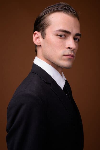 Premium Photo Portrait Of Young Caucasian Businessman Wearing Suit