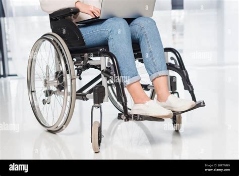 Low Section Disabled Woman Sitting Wheelchair Using Digital Tablet